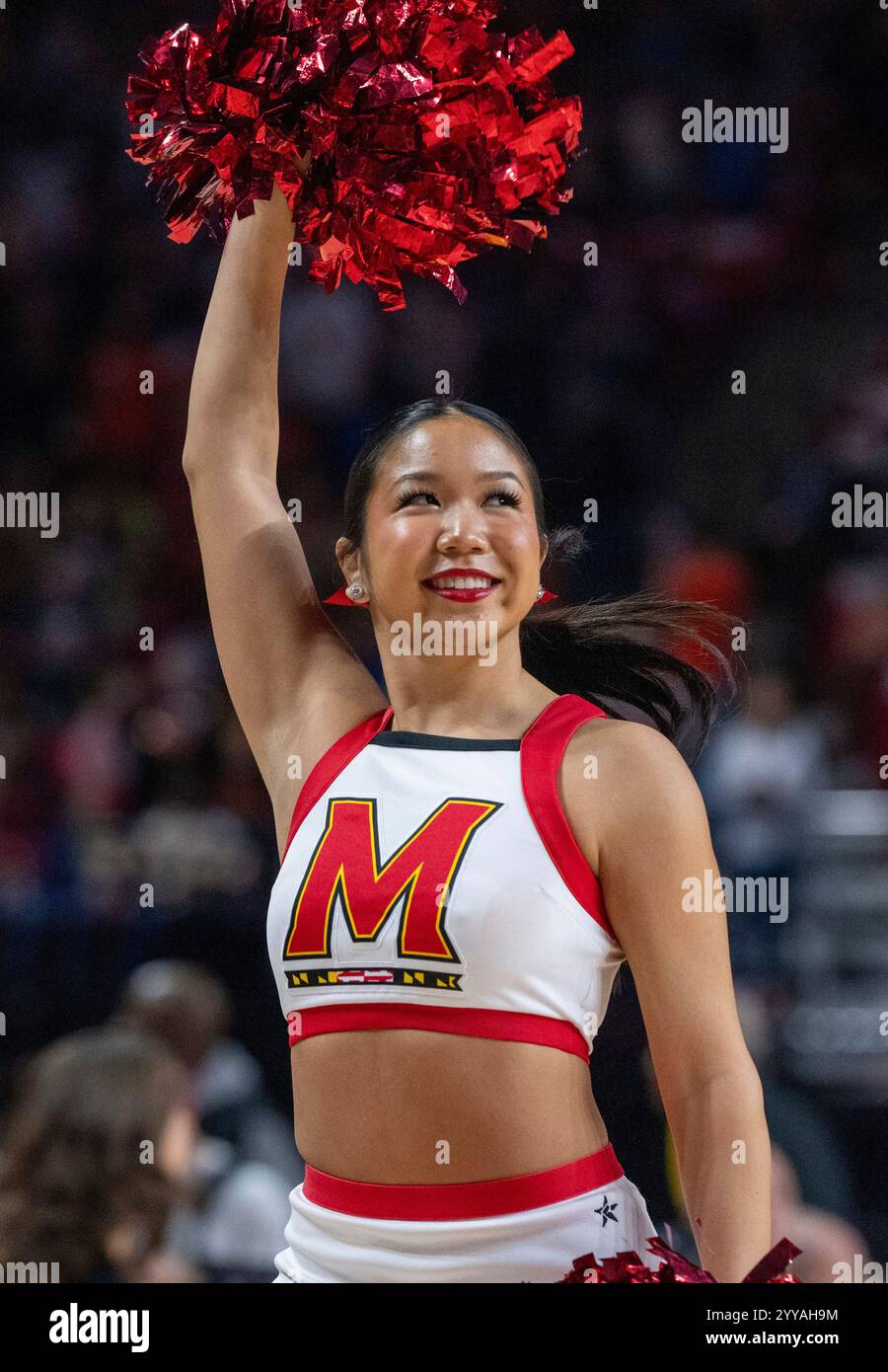COLLEGE PARK, MD - DECEMBER 19: Maryland cheerleader salutes the fans ...