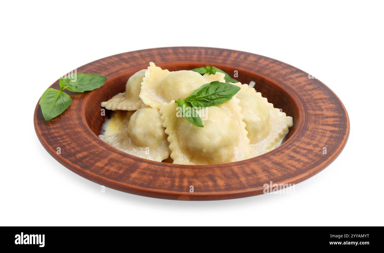 Delicious ravioli with cheese and basil in bowl isolated on white Stock ...