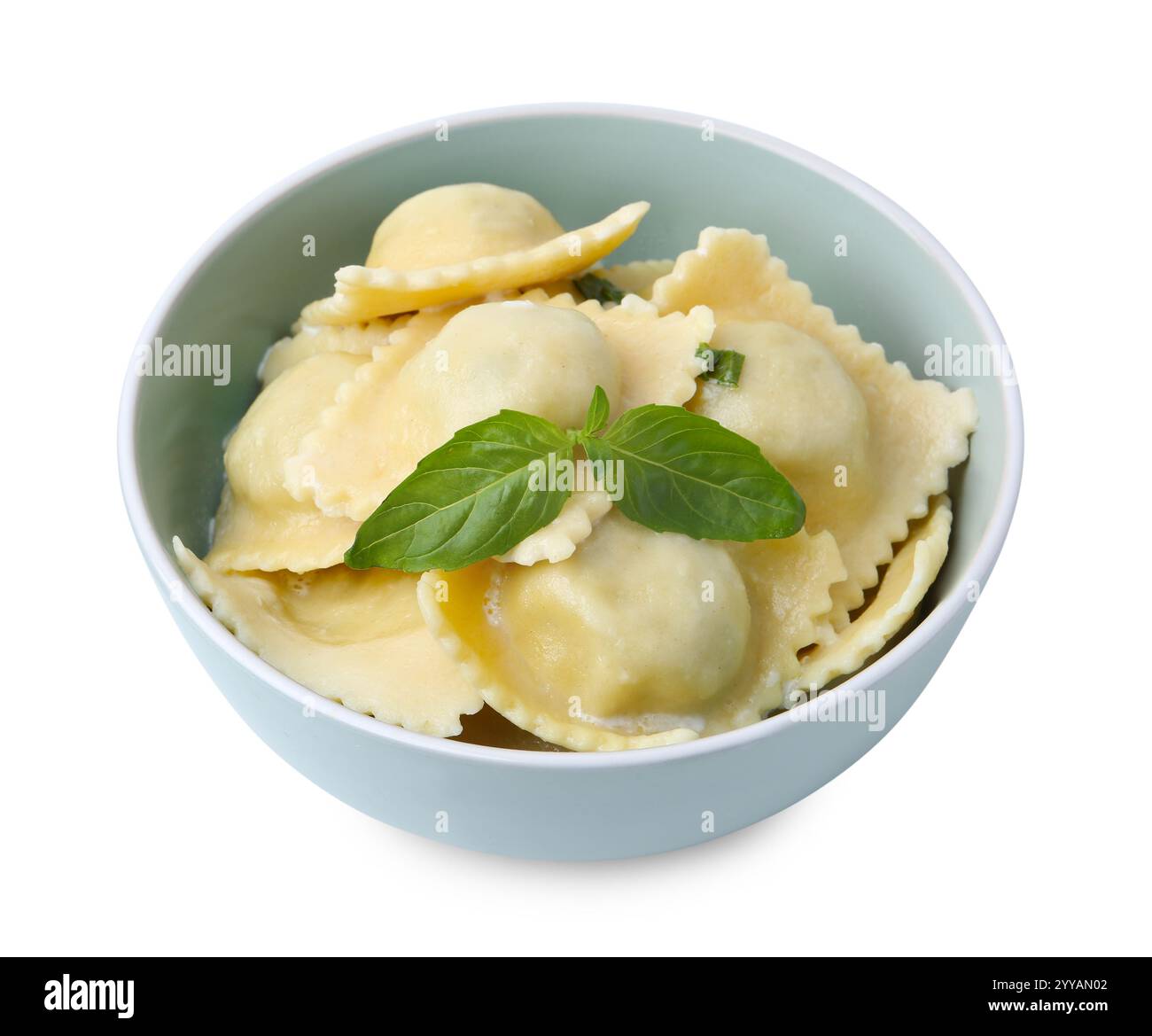 Delicious ravioli with cheese and basil in bowl isolated on white Stock ...