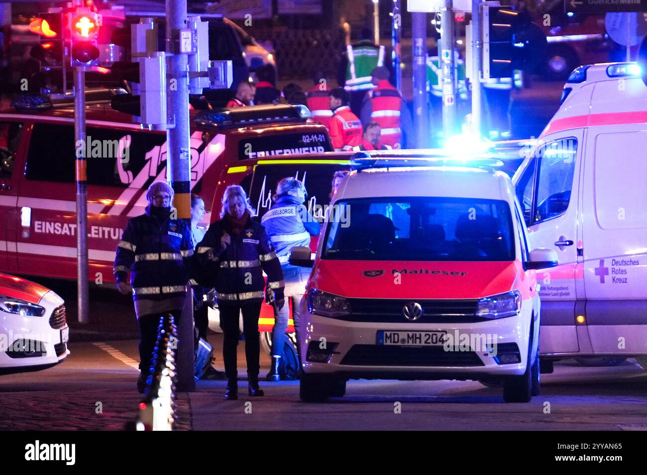 Emergency services work in a cordoned-off area near a Christmas Market ...