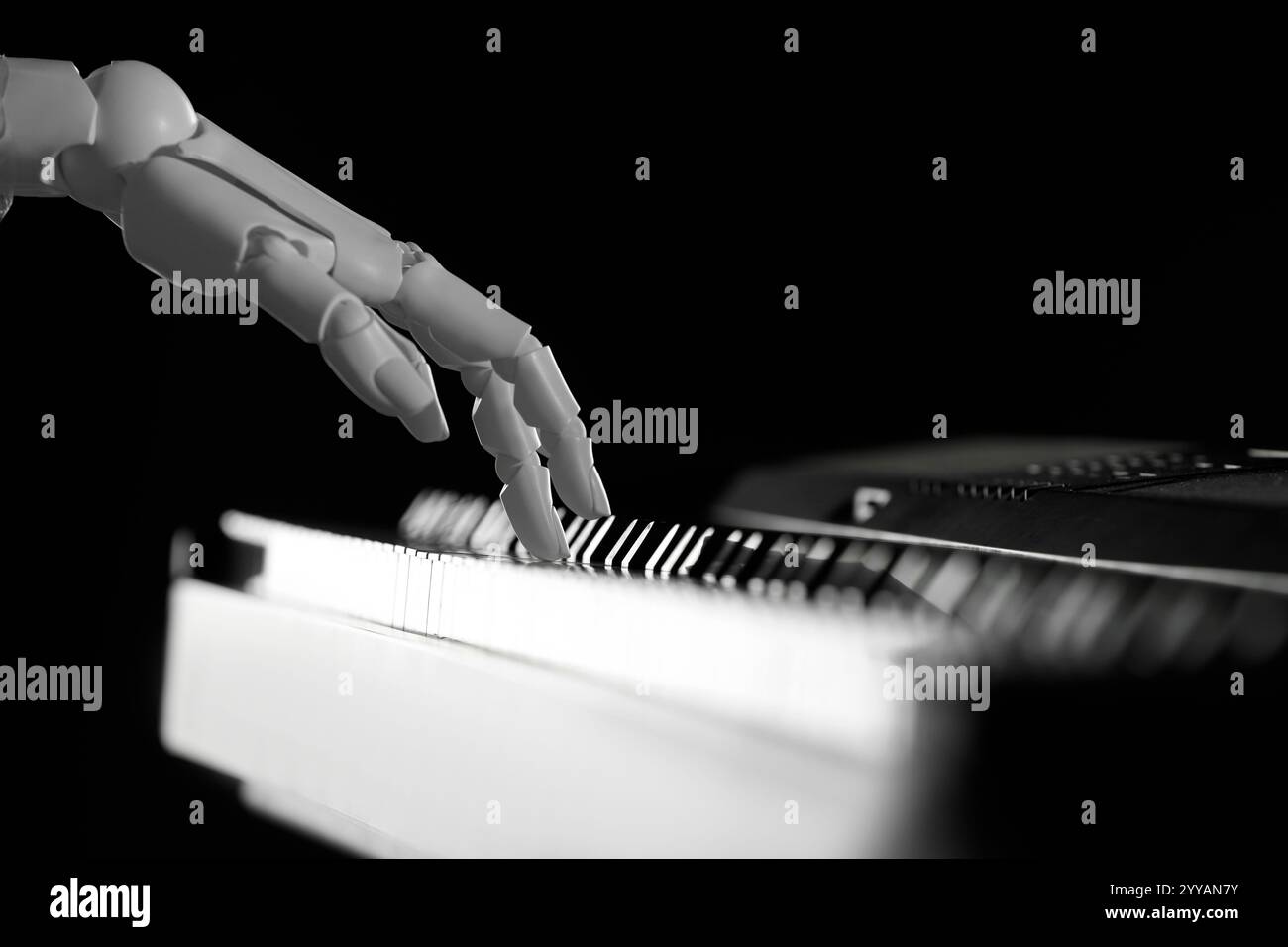 Artificial intelligence. Robot hand playing synthesizer on black ...