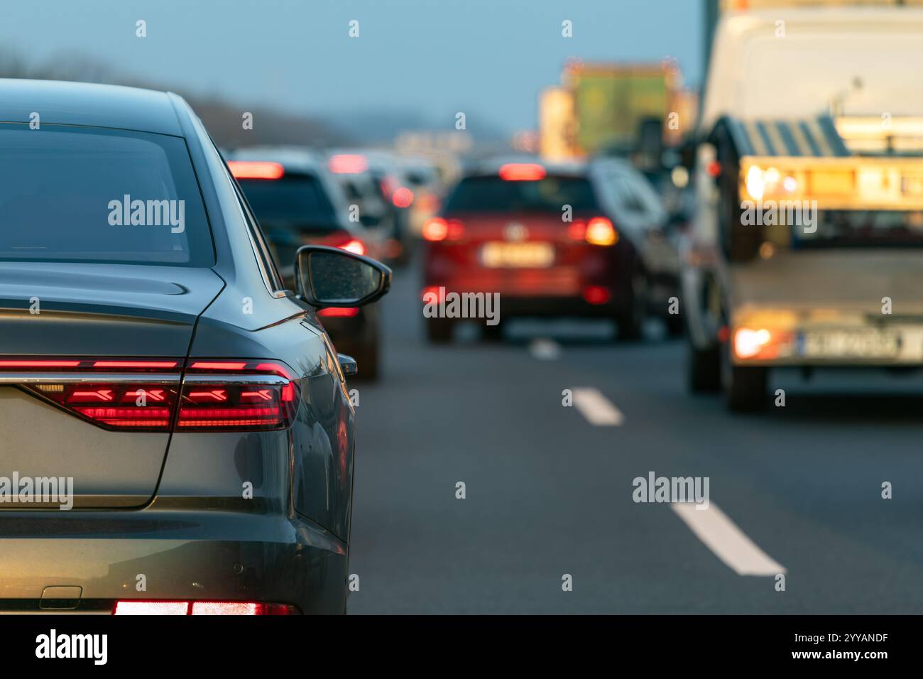 Car changes lanes in a traffic jam on the highway Stock Photo - Alamy