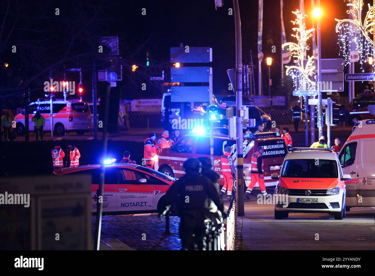 Emergency services work in a cordoned-off area near a Christmas Market ...