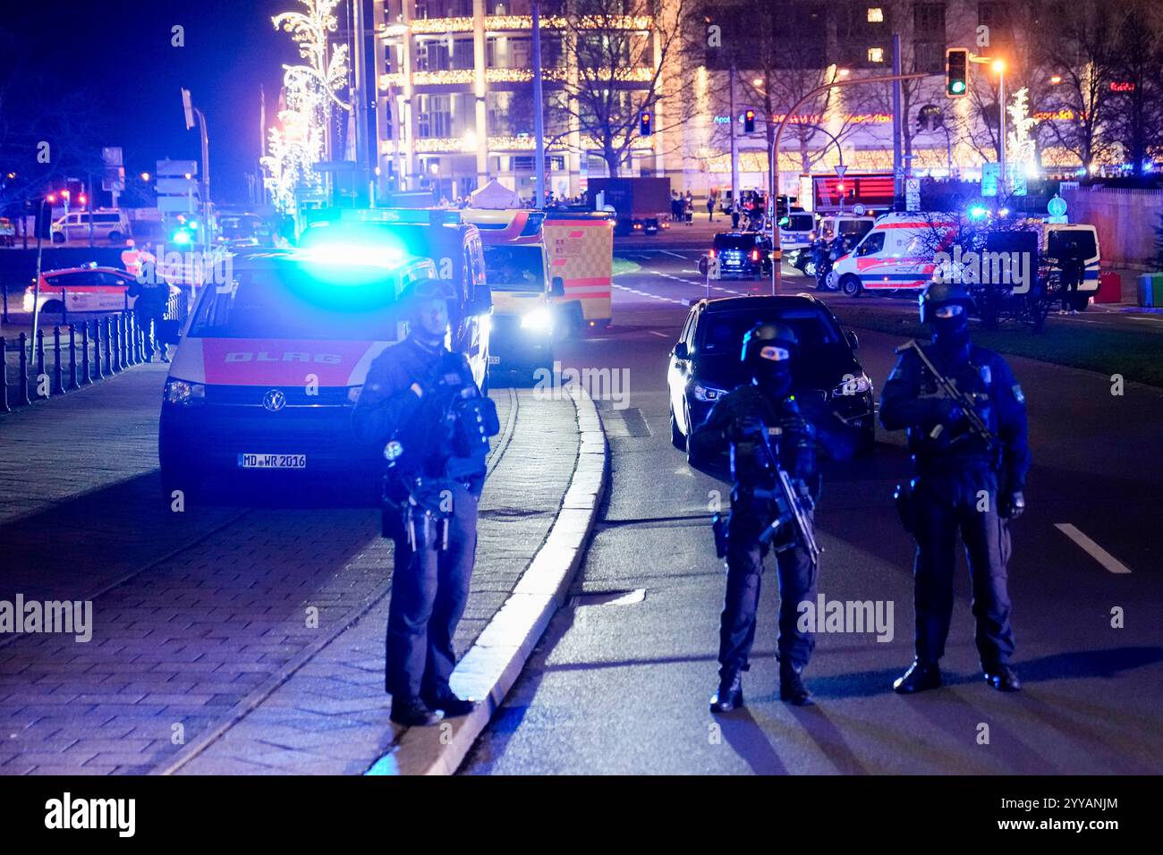 Police officers guard at a cordoned-off area near a Christmas Market ...