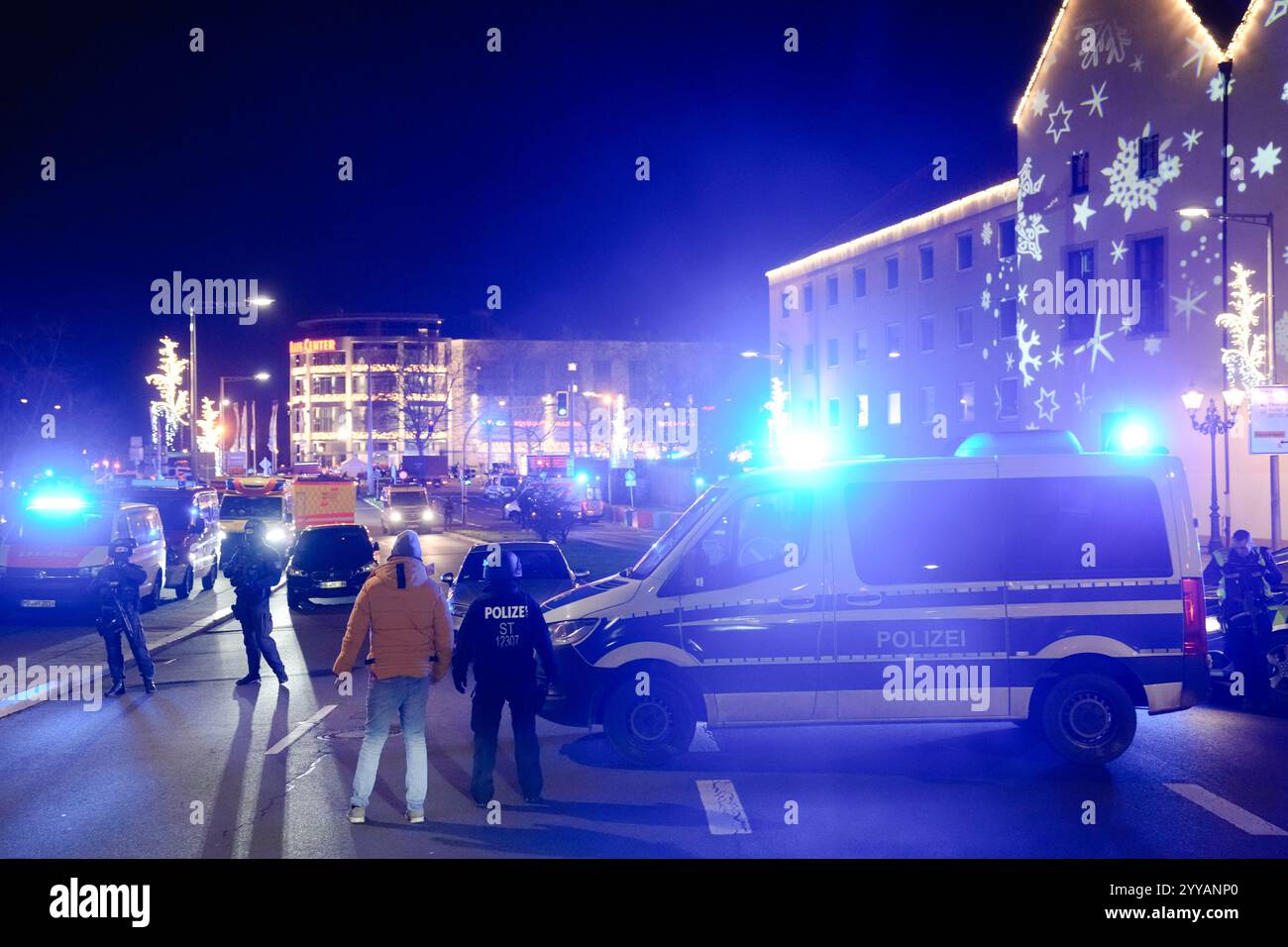Police officers guard at a cordoned-off area near a Christmas Market ...