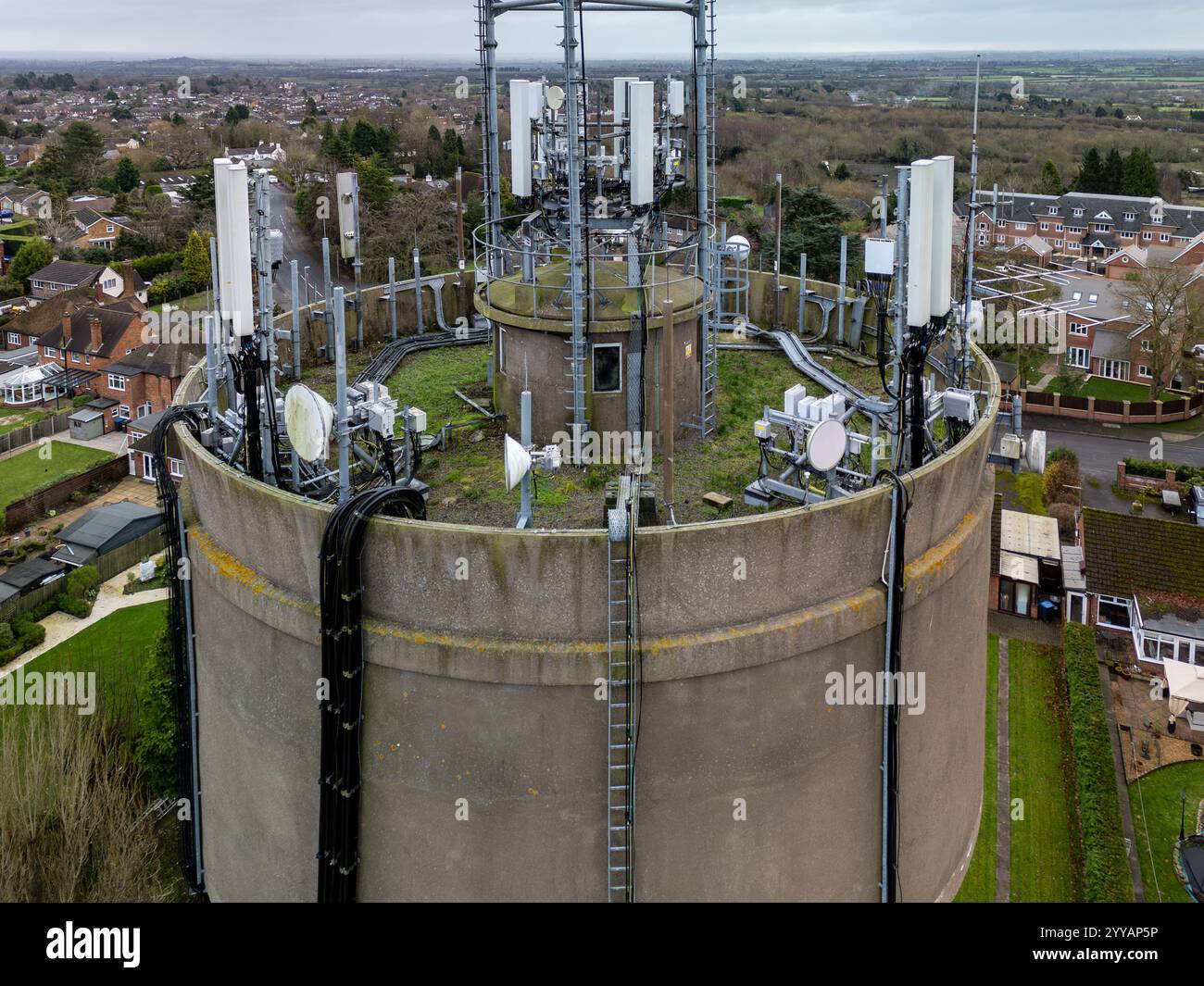 Mobile network antennas are installed on top of a water tower ...