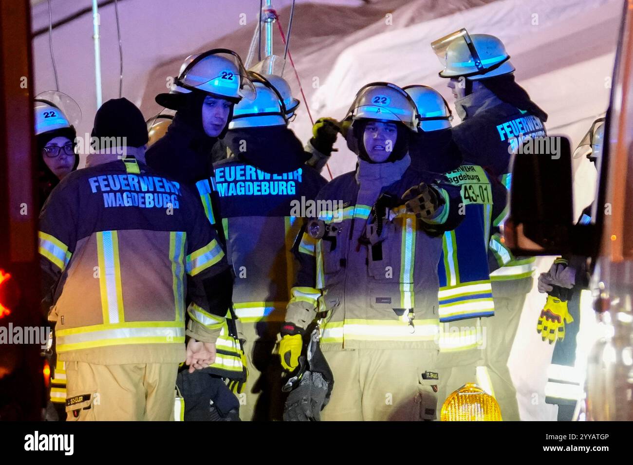 Emergency services work in a cordoned-off area near a Christmas Market ...
