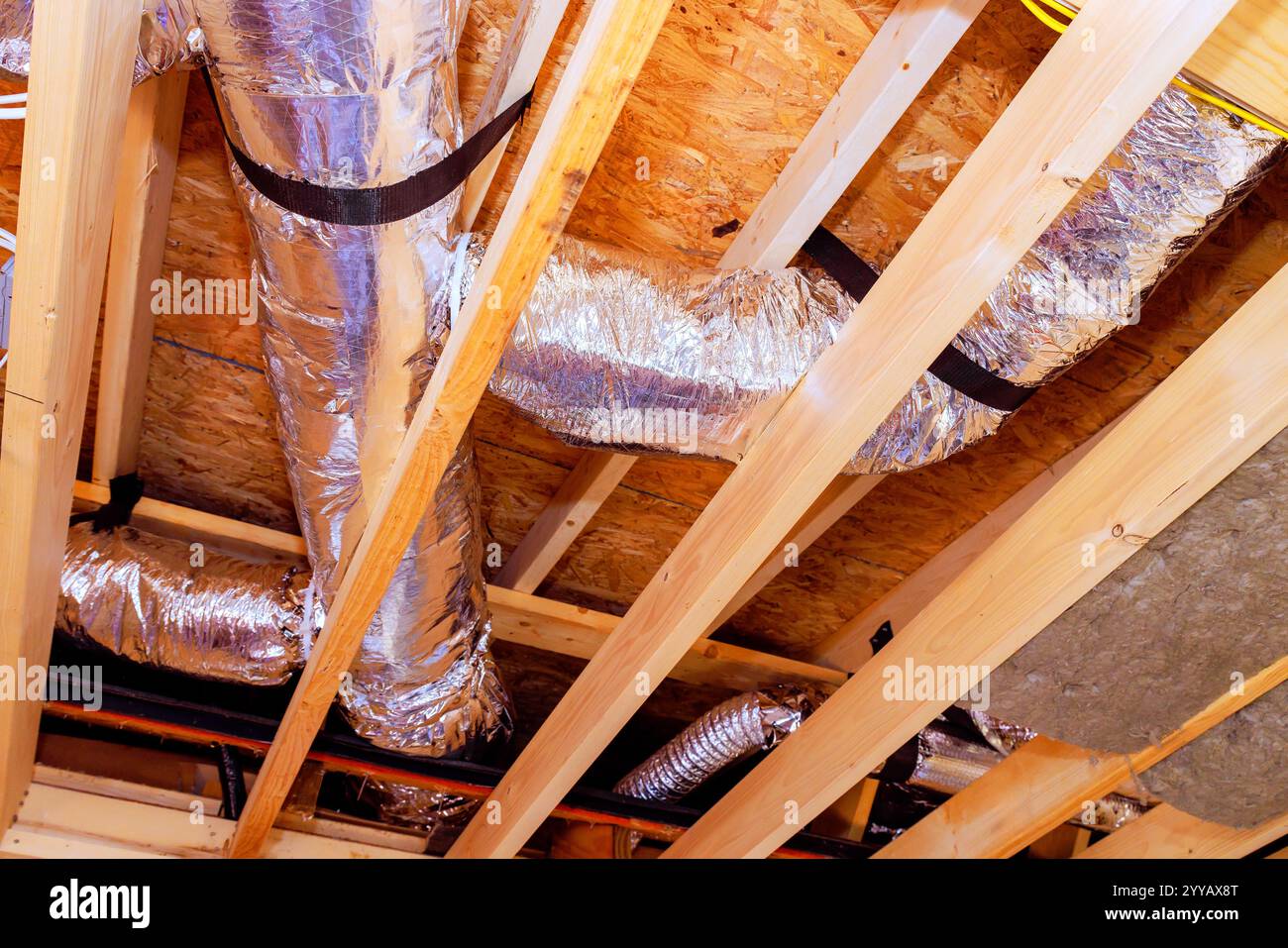 Metal ductwork, beams are exposed in ceiling, during ongoing renovation ...