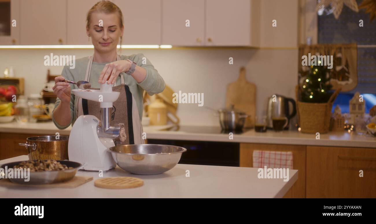 Woman meat grinder hi-res stock photography and images - Alamy