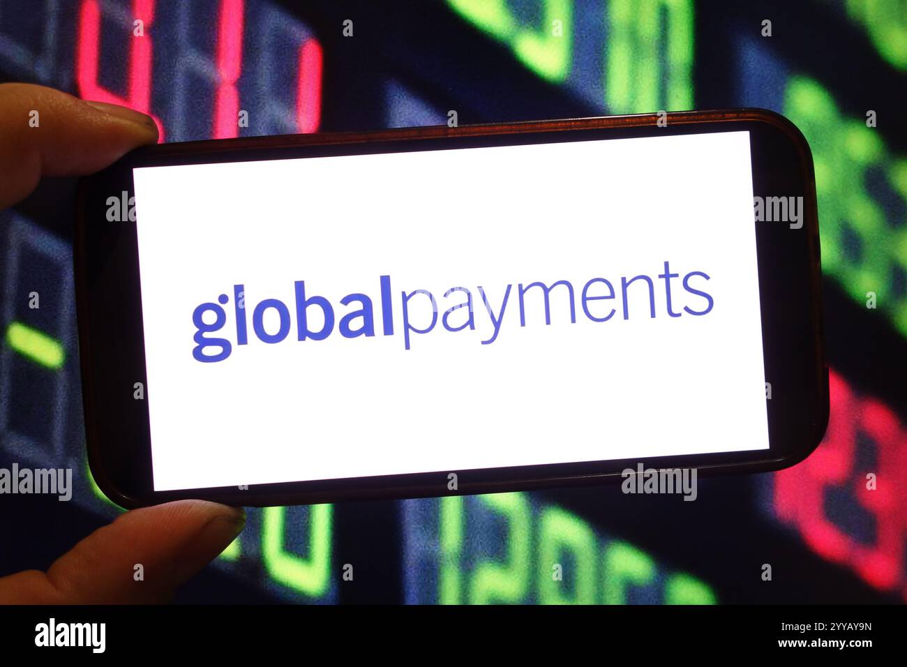 In this photo illustration, the Global Payments company logo is seen displayed on a smartphone ...