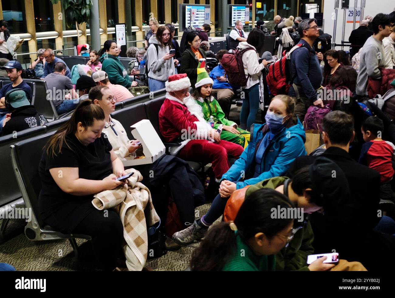 Ottawa, Canada. 20th Dec, 2024. Dressed as Santa Claus and his elf ...