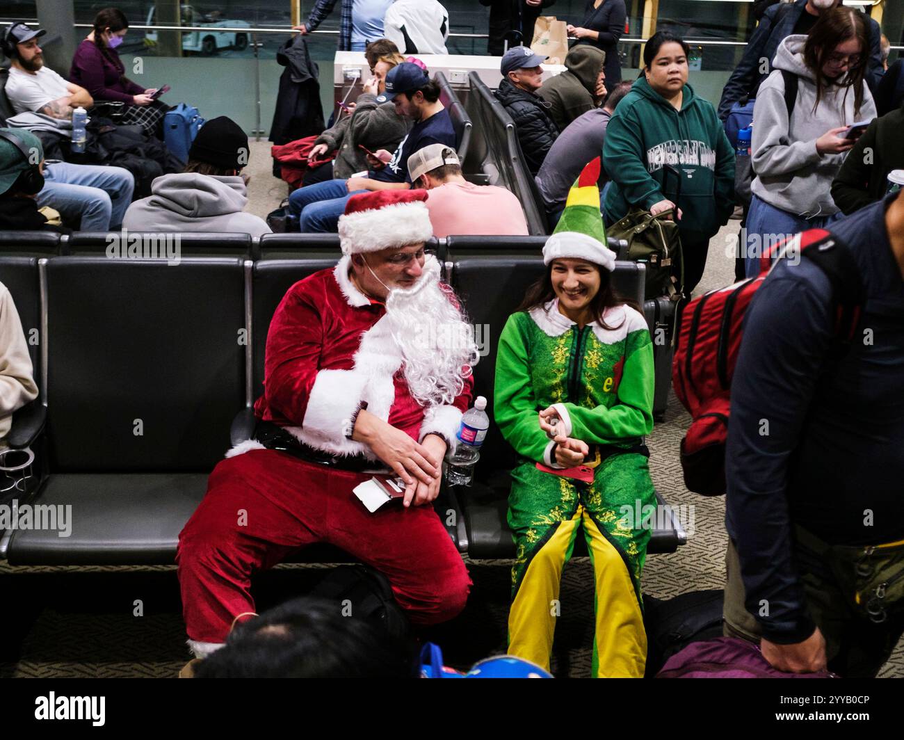 Ottawa, Canada. 20th Dec, 2024. Dressed as Santa Claus and his elf ...