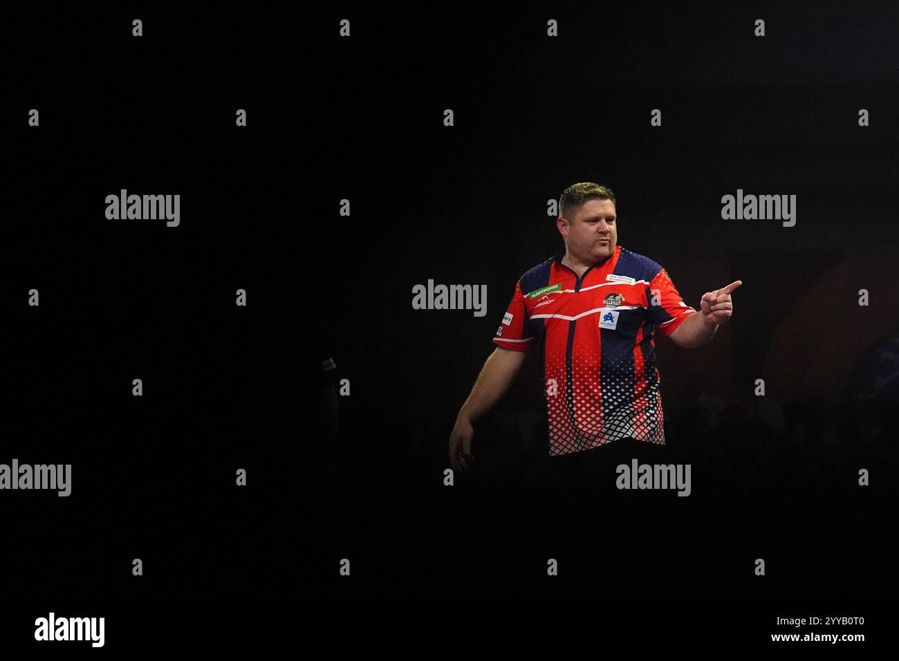 James Hurrell in action against Michael van Gerwen (not pictured ...