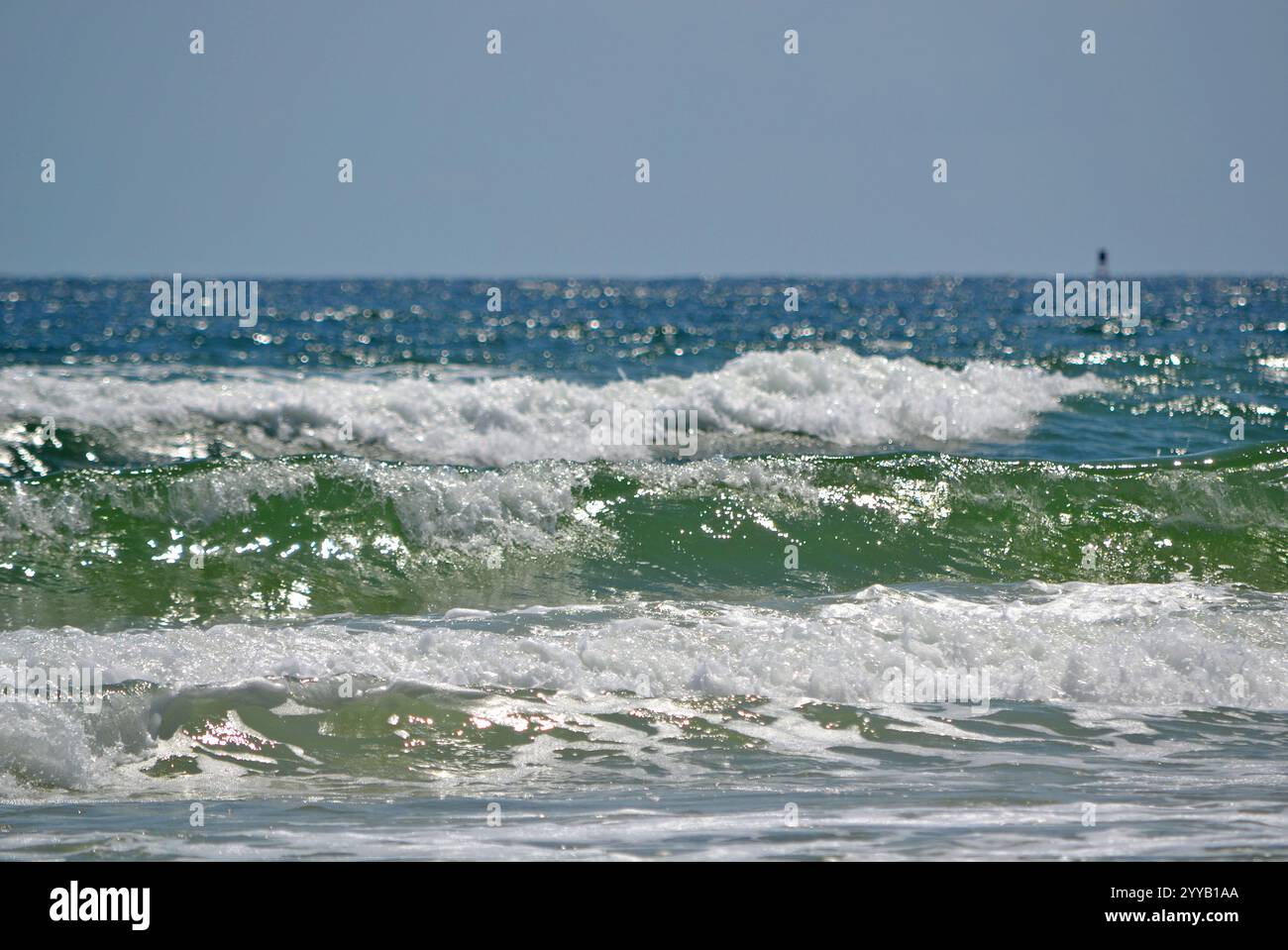 The crashing waves in the ocean at Ponce Inlet Beach, Florida, with a ...