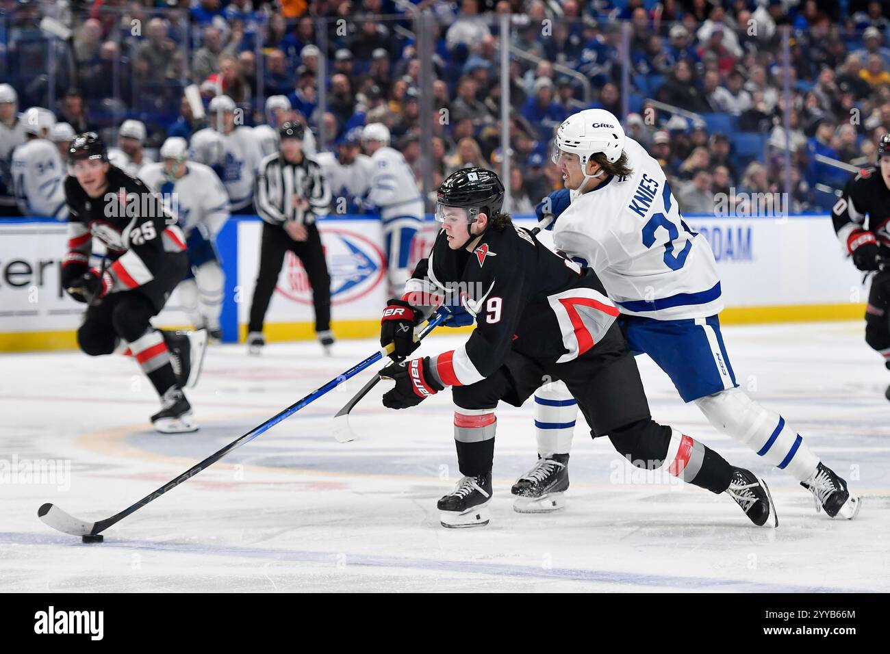 Buffalo Sabres left wing Zach Benson (9) reaches for the puck against ...