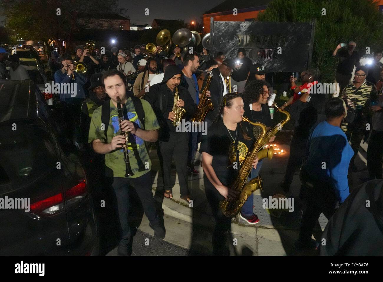 Musicians and friends form a second line parade organized by Orlando ...