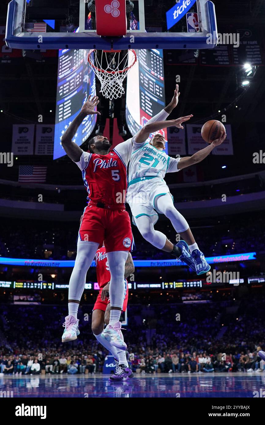 Charlotte Hornets' Isaiah Wong and Philadelphia 76ers' Andre Drummond play during an NBA ...