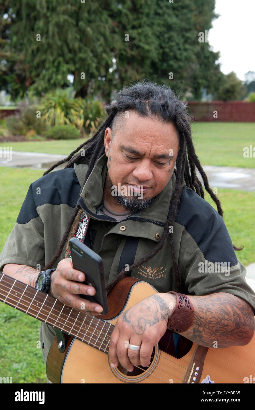 Maori man holding guitar hi-res stock photography and images - Alamy