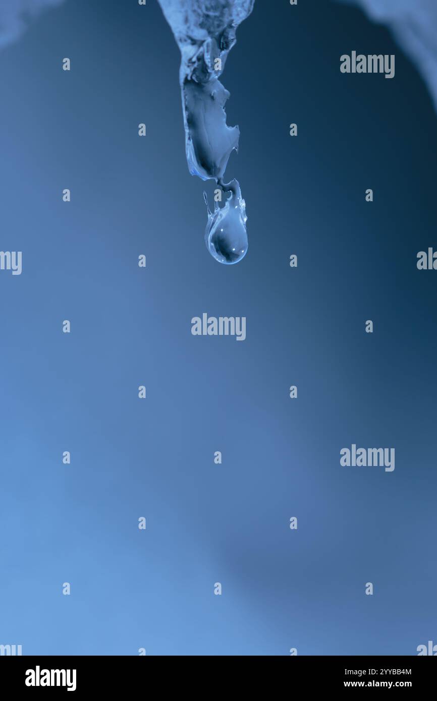 Frozen water drop on small icicle Stock Photo - Alamy