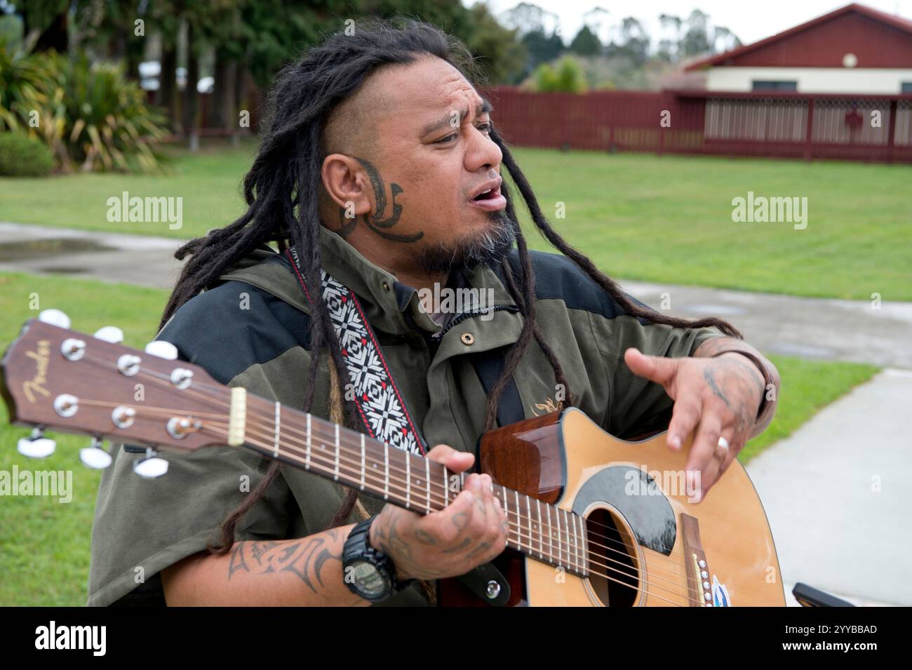 Maori man playing guitar and singing hi-res stock photography and ...