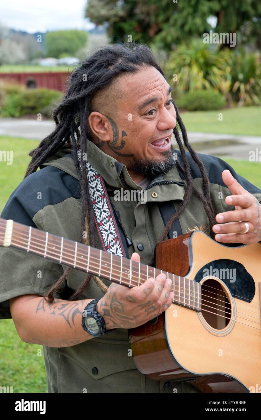 Maori man singing and playing guitar in New Zealand Stock Photo - Alamy