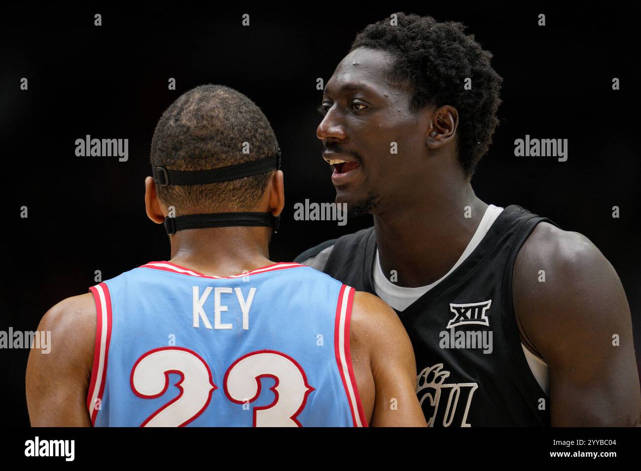 Cincinnati's Aziz Bandaogo, right, speaks with Dayton's Zed Key (23 ...