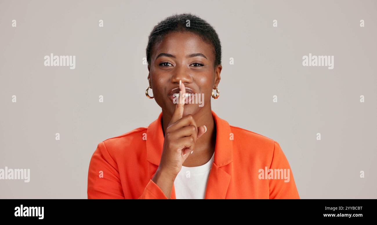 Black woman, portrait and finger silence in studio, confidential ...