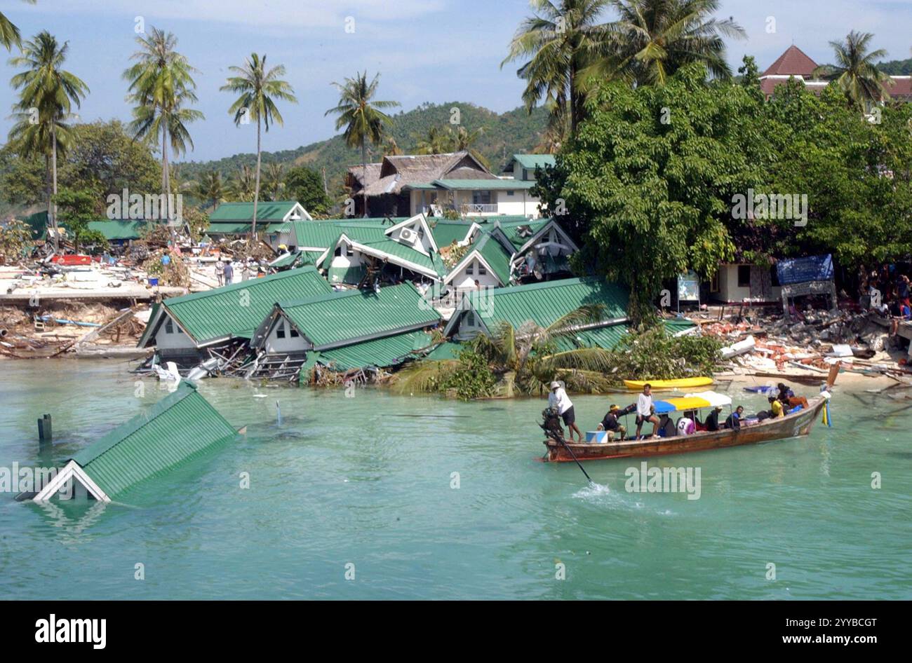 A boat passes by a damaged hotel, at Ton Sai Bay on Phi Phi Island, in ...