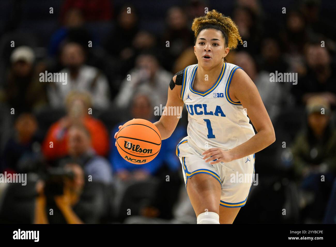 UCLA guard Kiki Rice (1) dribbles against Creighton during the first half of an NCAA college ...