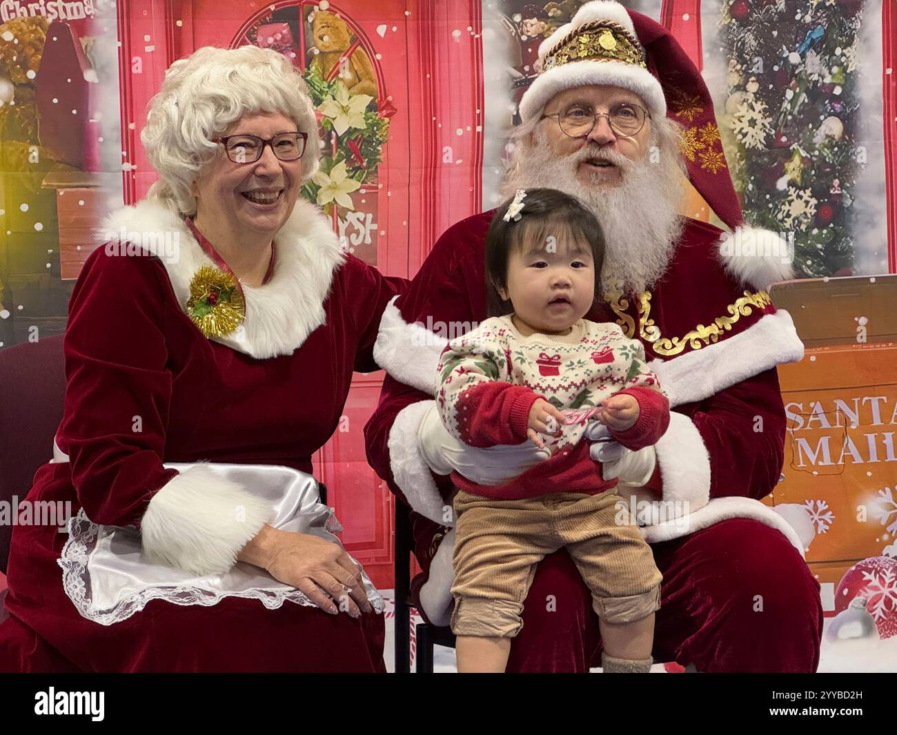 Santa and Mrs. Claus talk to a child in Yakutat, Alaska, in the Alaska ...