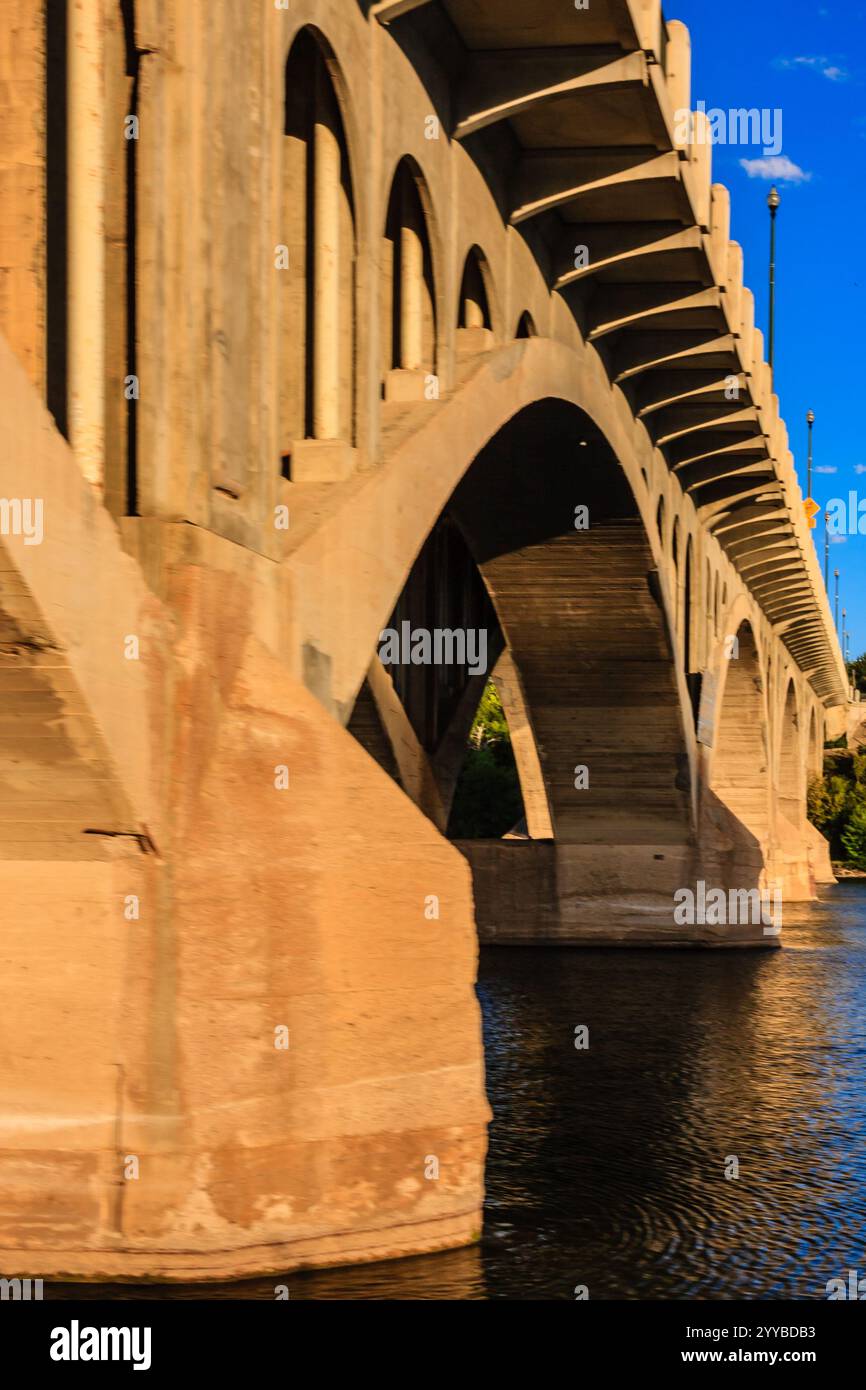 The bridge is a large, arched structure with a lot of detail. The water ...
