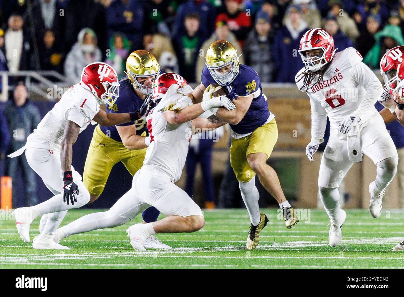South Bend, Indiana, USA. 20th Dec, 2024. Notre Dame running back Aneyas Williams (20) runs with ...