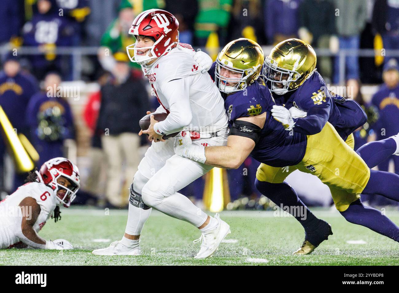 South Bend, Indiana, USA. 20th Dec, 2024. Notre Dame defensive lineman Rylie Mills (99) sacks ...