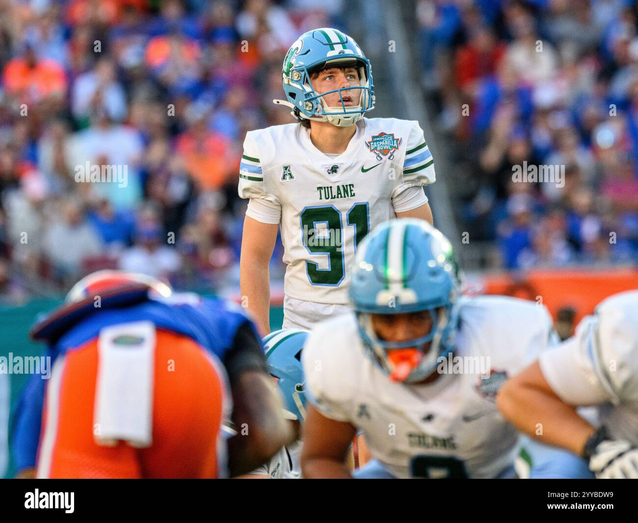 Tampa, FL, USA. 20th Dec, 2024. Tulane Green Wave place kicker Patrick ...