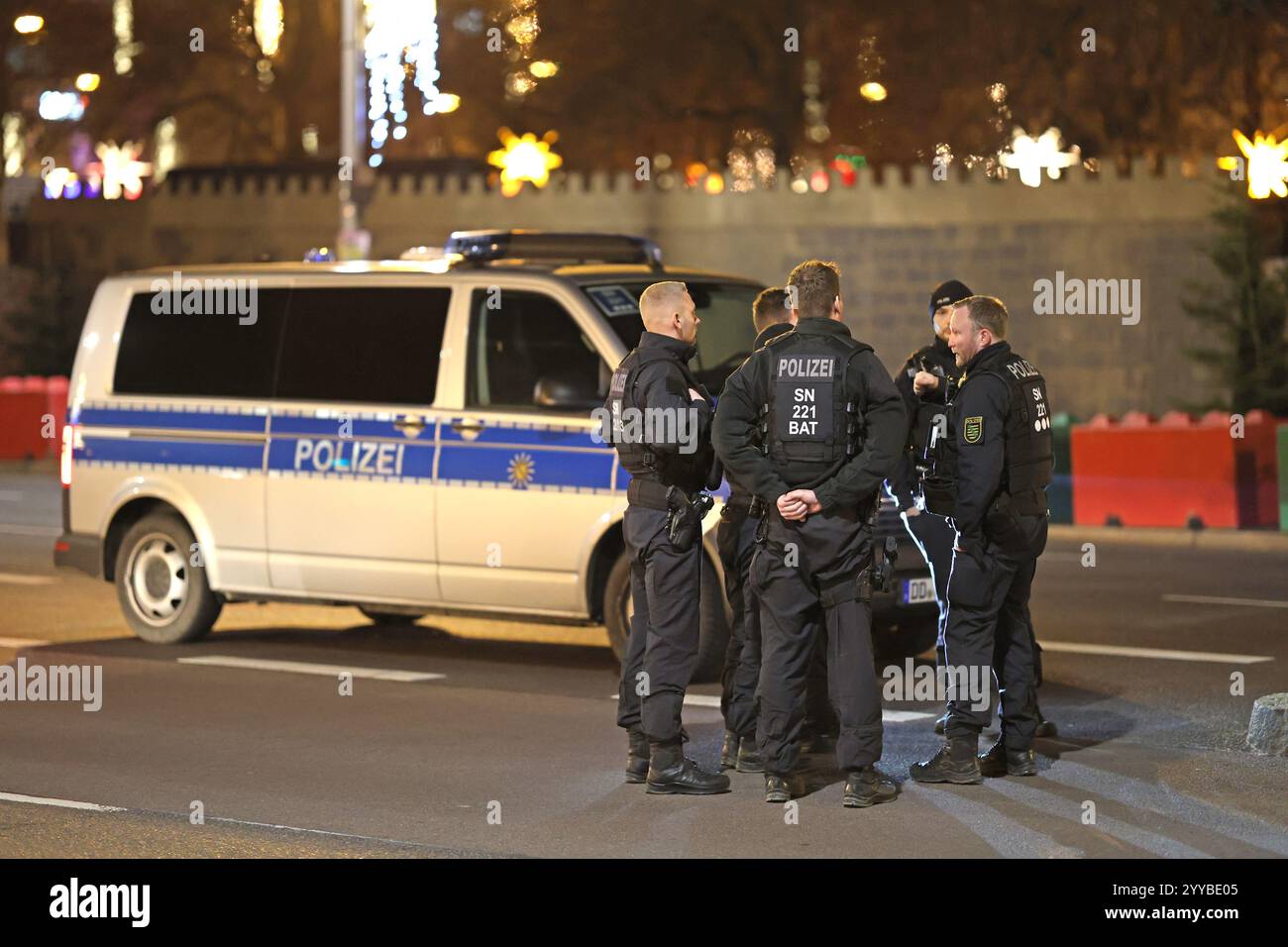 Magdeburg, Germany. 21st Dec, 2024. Police officers stand in front of ...