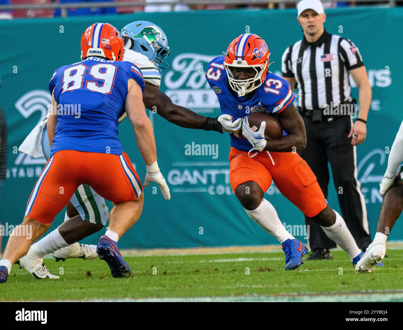 Tampa, USA. 20th Dec, 2024. December 20, 2024: Florida Gators running ...