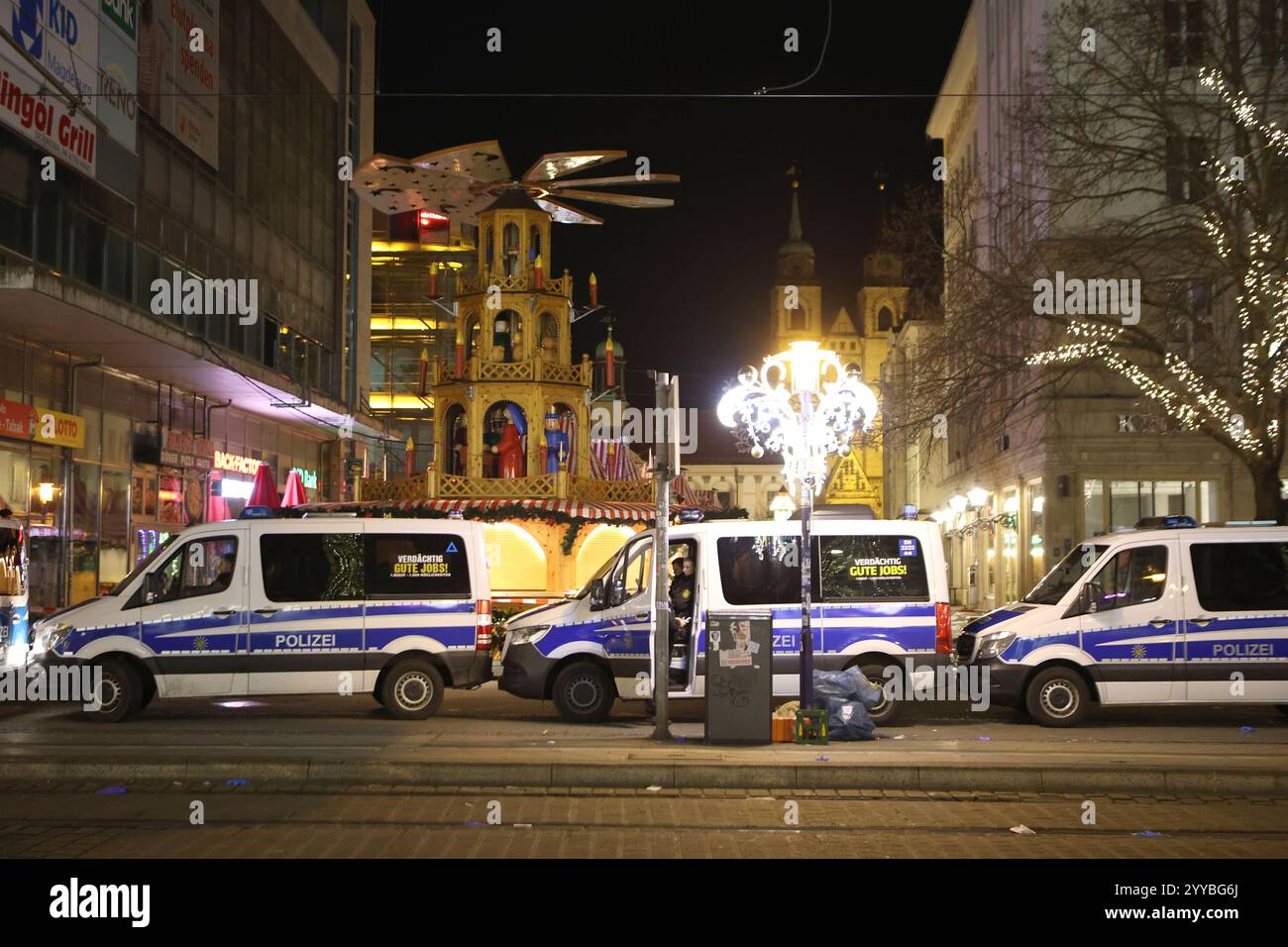 Magdeburg, Germany. 21st Dec, 2024. Police emergency vehicles in front ...