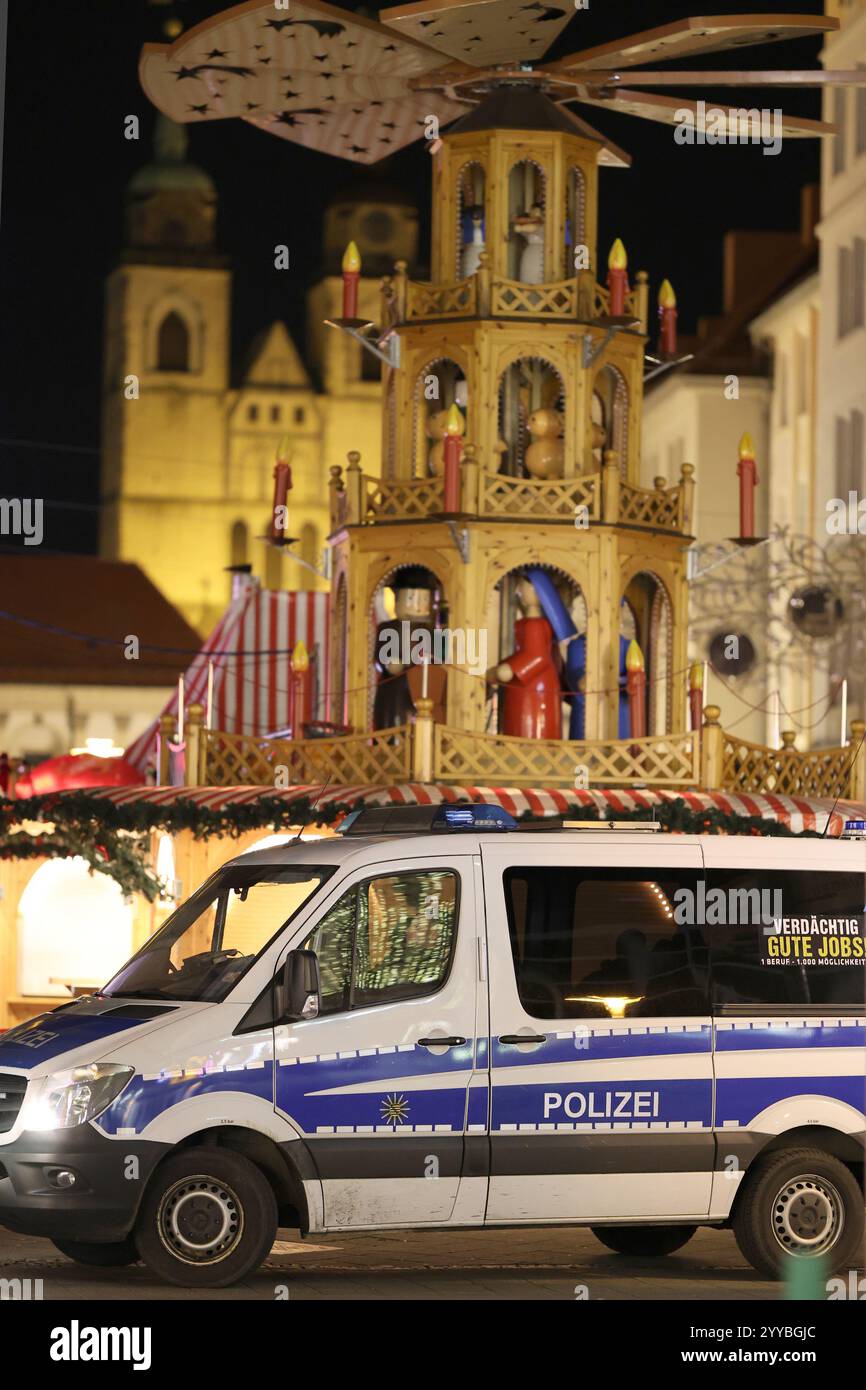 Magdeburg, Germany. 21st Dec, 2024. Police emergency vehicles at the ...