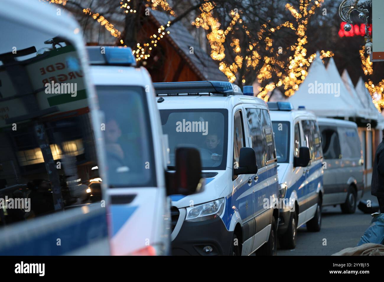 Magdeburg, Germany. 21st Dec, 2024. Police emergency vehicles cordon ...