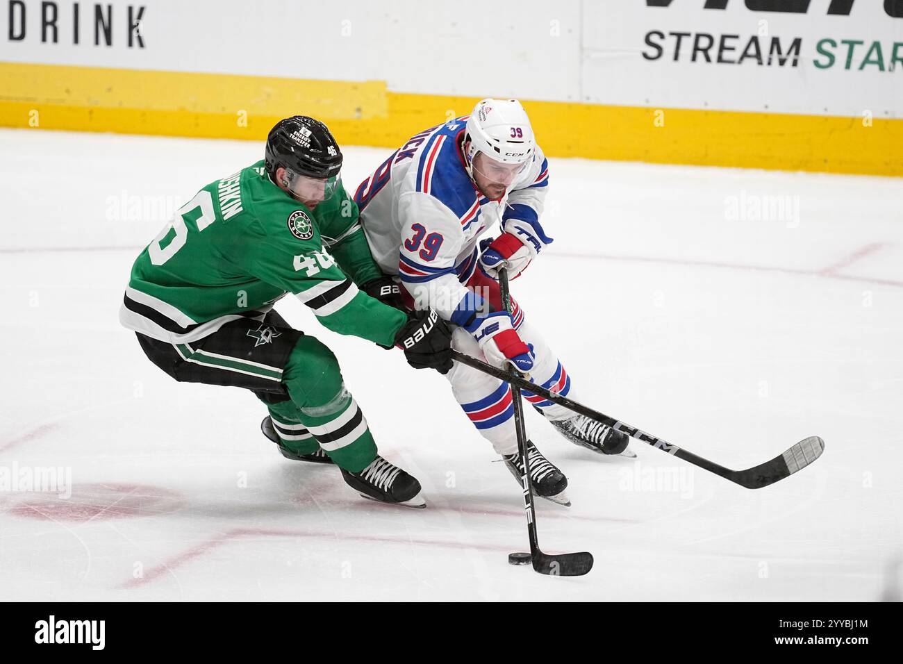 Dallas Stars' Ilya Lyubushkin (46) and New York Rangers' Sam Carrick ...
