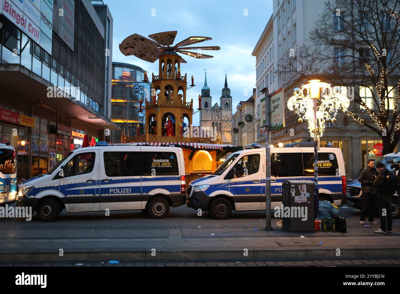 21 December 2024, Saxony-Anhalt, Magdeburg: Police emergency vehicles ...