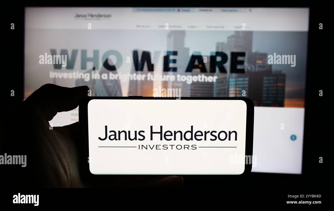 In this photo illustration, a person is holding a cellphone with the ...