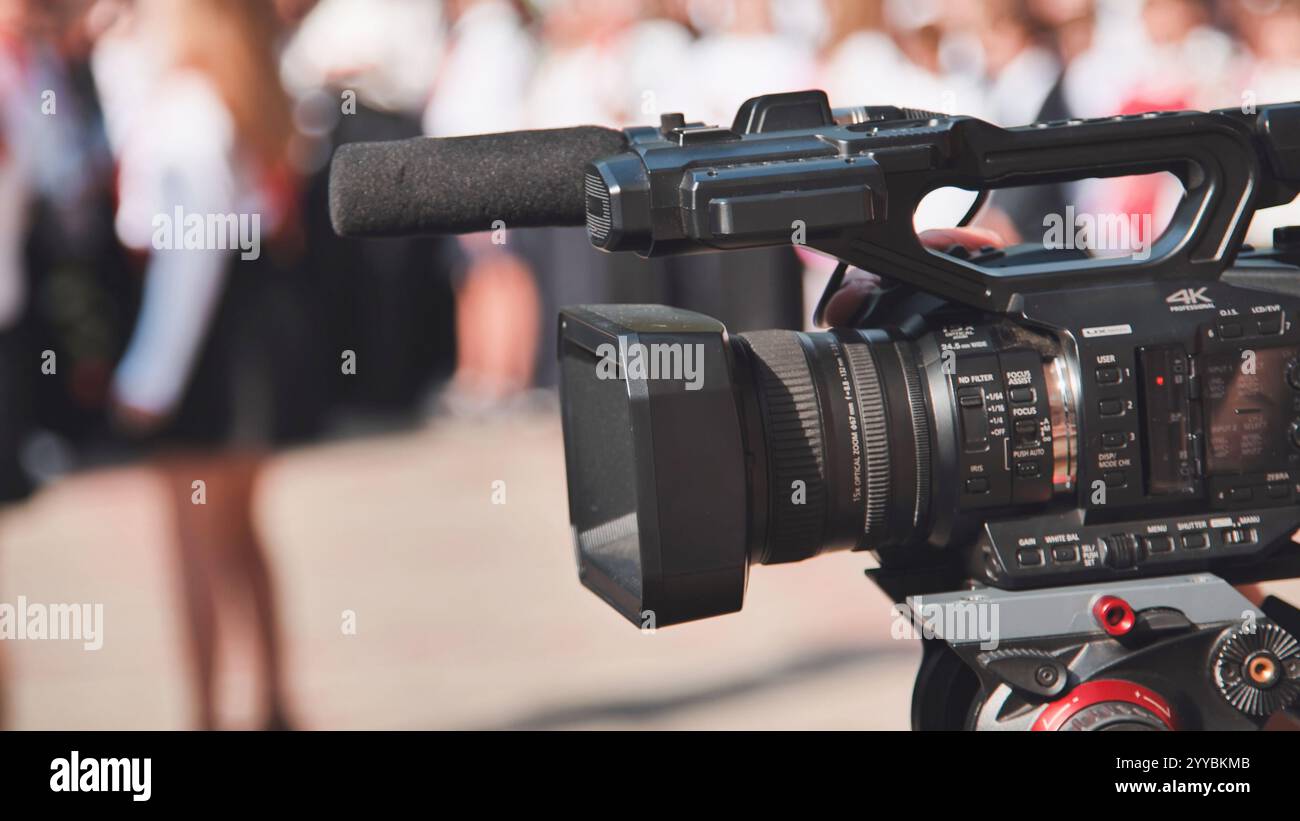 Professional video camera filming children during first school day ...