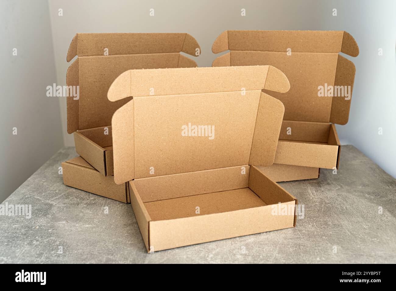 Three open kraft cardboard boxes Stock Photo - Alamy