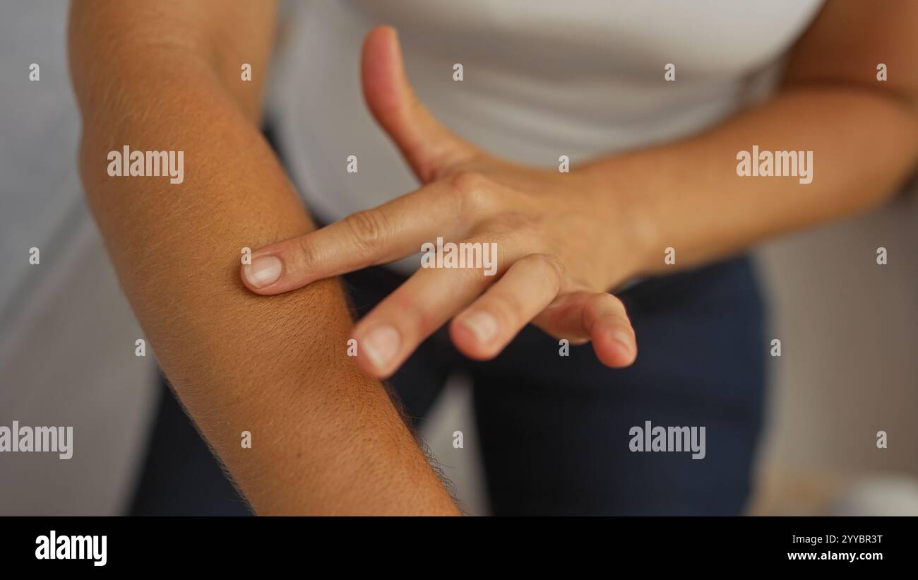 Woman receiving arm treatment in wellness spa focuses on hands and skin ...