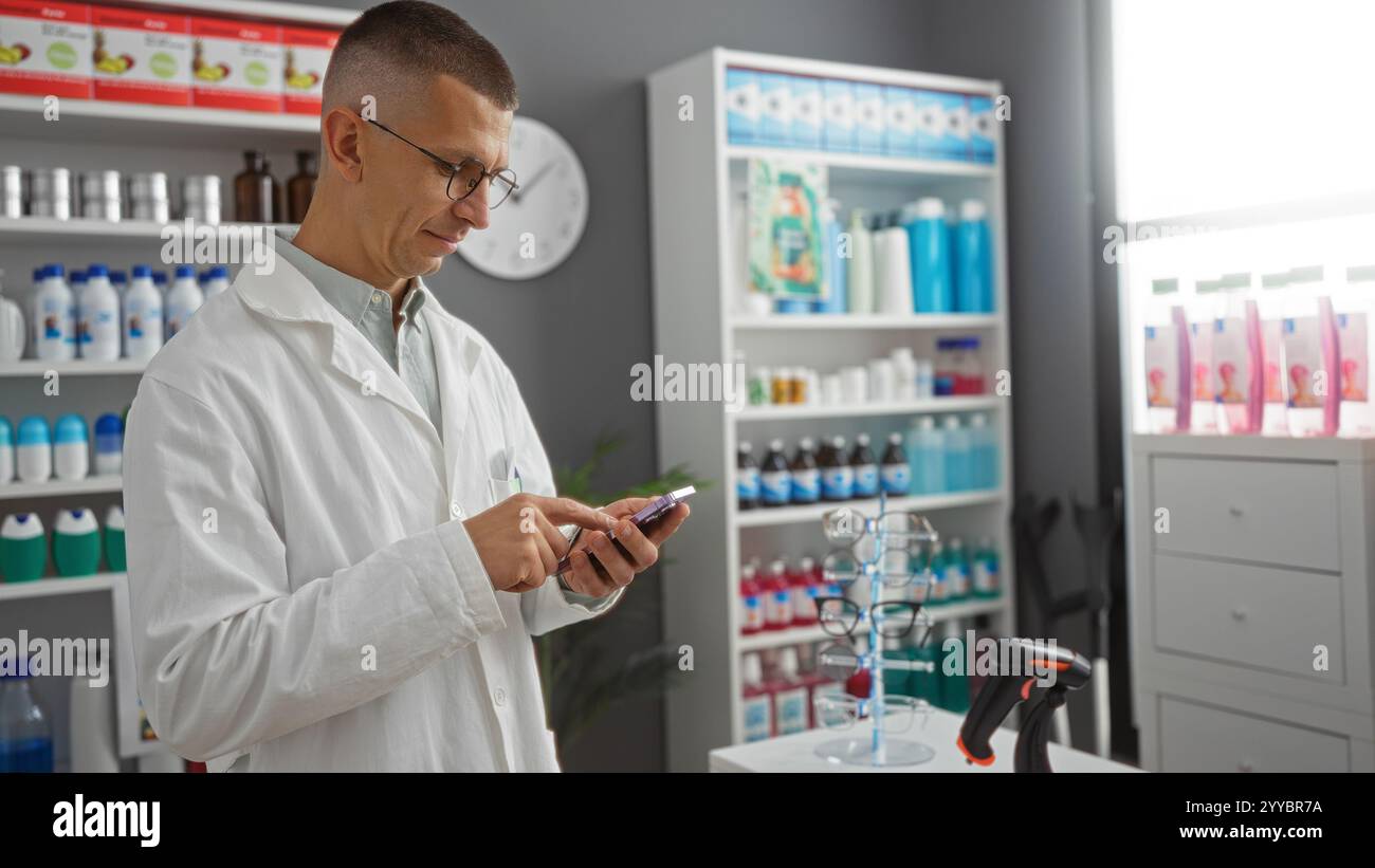 Pharmacist wearing white coat using smartphone in a well-organized ...
