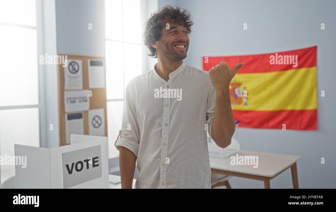 Young man voting in a spanish electoral room with a flag in the ...