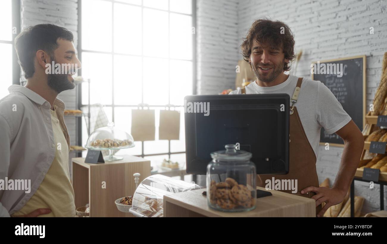 Man talking to a baker in a bright bakery shop interior, with baked ...