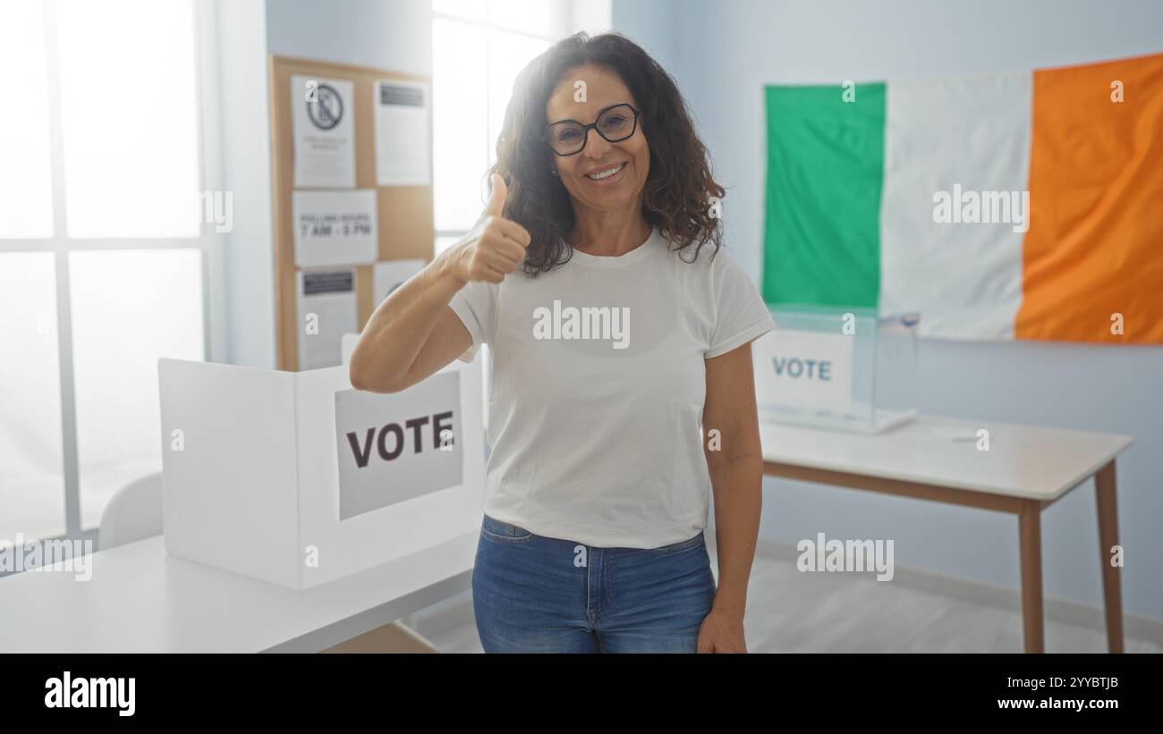 Woman giving thumbs up at an irish electoral college room with a voting ...