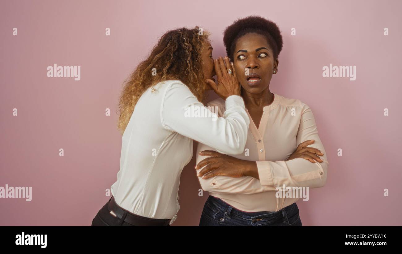 Women friends whispering together over isolated pink background with an ...